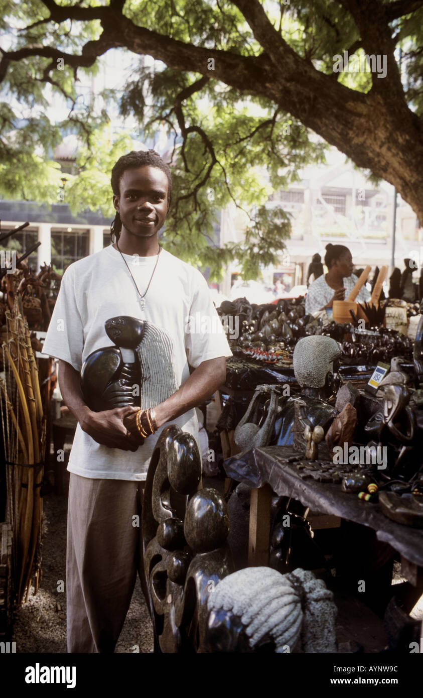 Man selling crafts on a market stall in Harare, Zimbabwe, East Africa ...