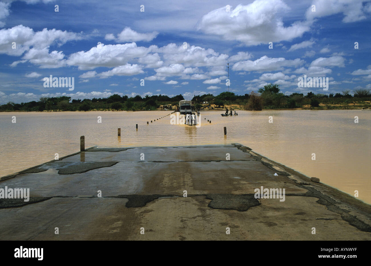 An overflowing river floods a bridge, near Tahoua, Niger, West Africa ...