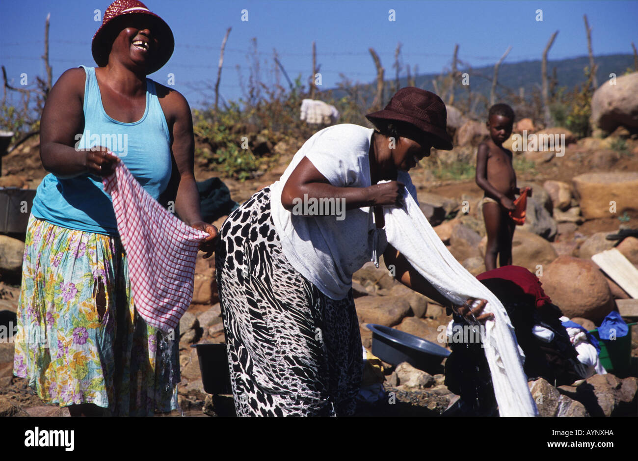 African women wash in river hi-res stock photography and images - Alamy