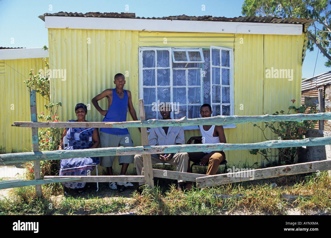 Family outside traditional shack, Khayelitsha township, Cape Town ...