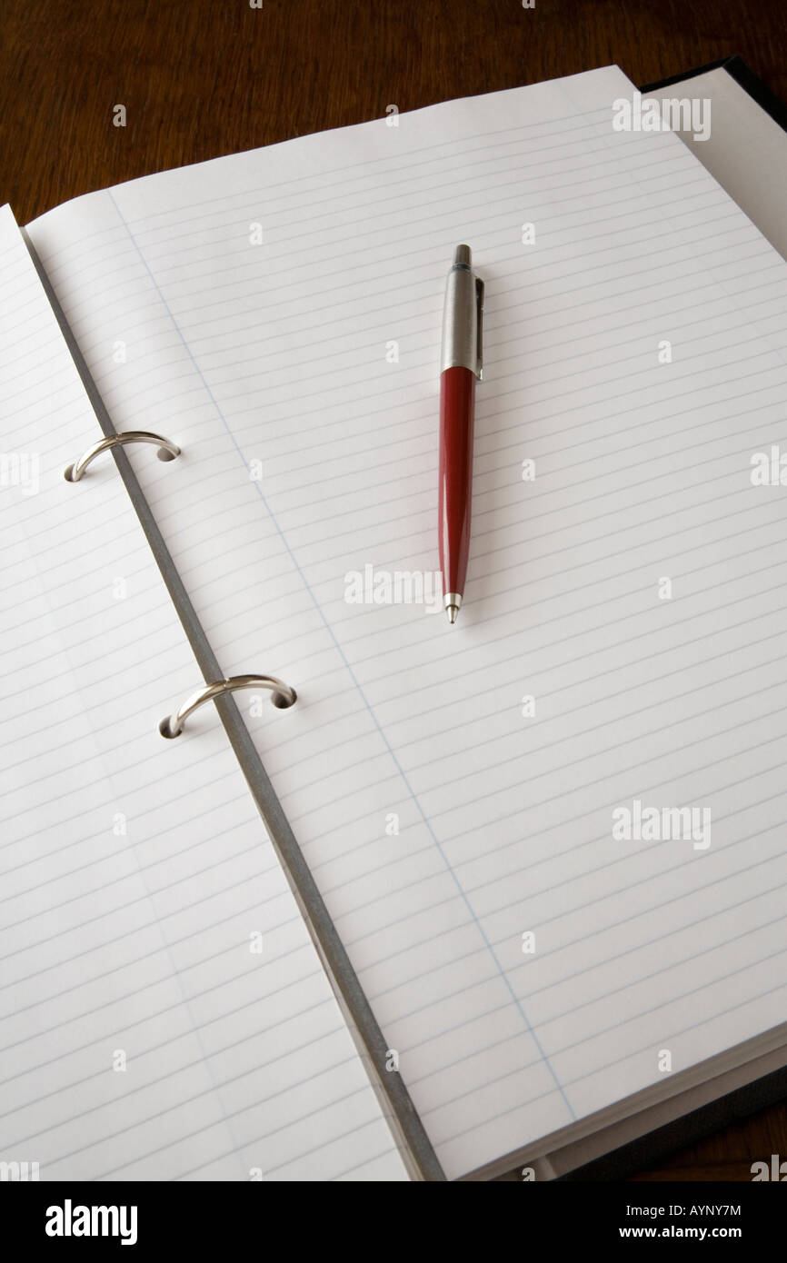 A pen on a blank writing pad Stock Photo - Alamy