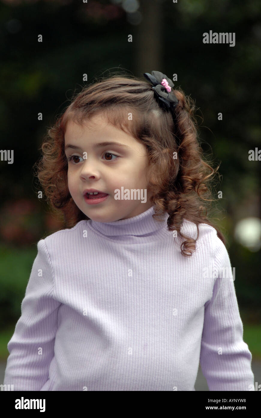 Three year old girl three quarter view Stock Photo - Alamy