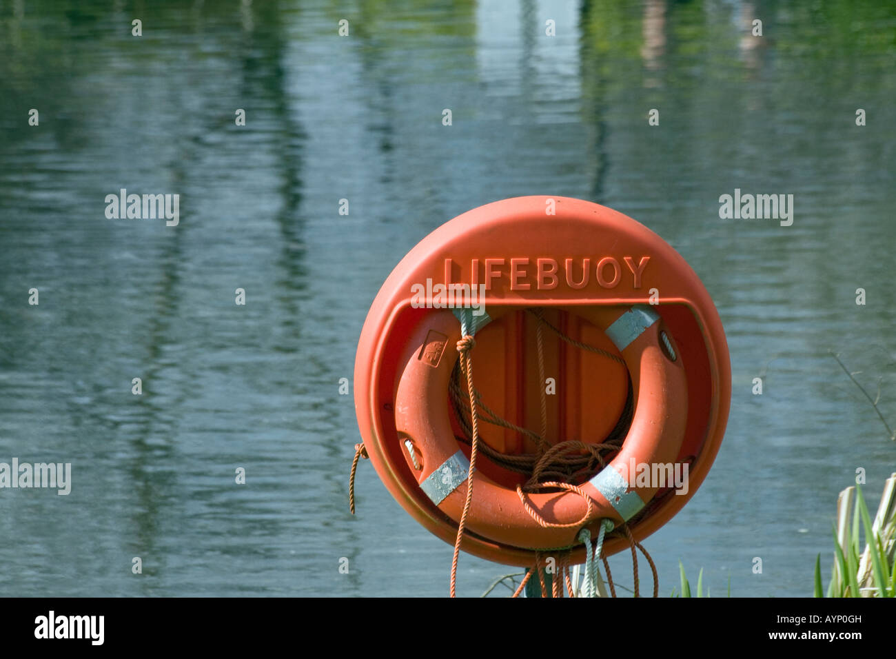 Lifebuoy near area of deep water Stock Photo - Alamy