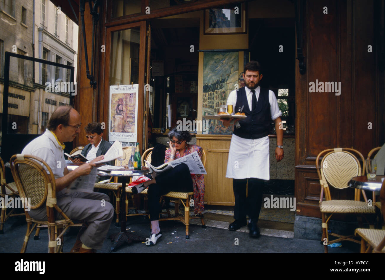 FRANCE Ile de France Paris La Palette Cafe waiter carries drinks on ...