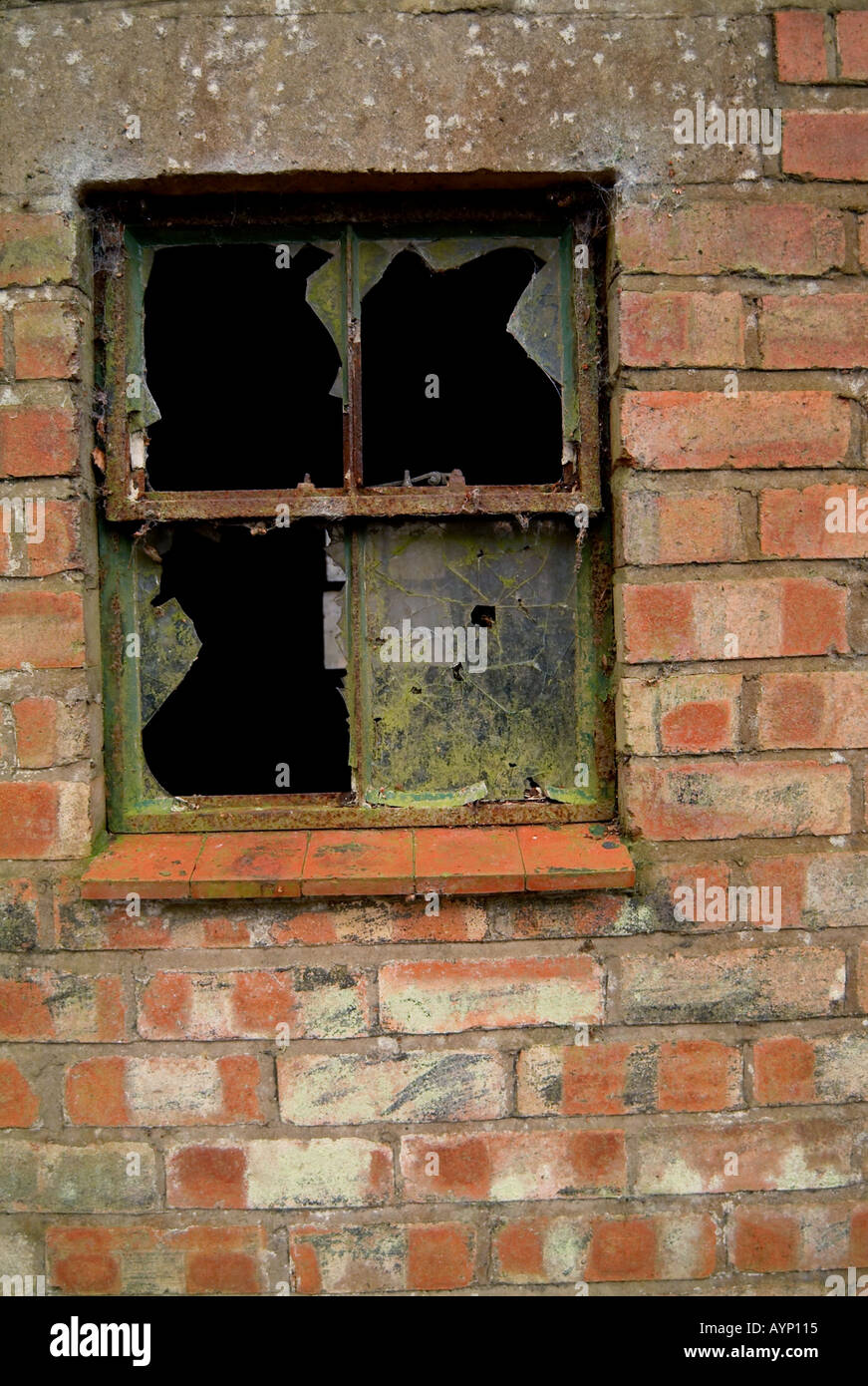 run down building deralict disused tatty abandoned broken window glass ...