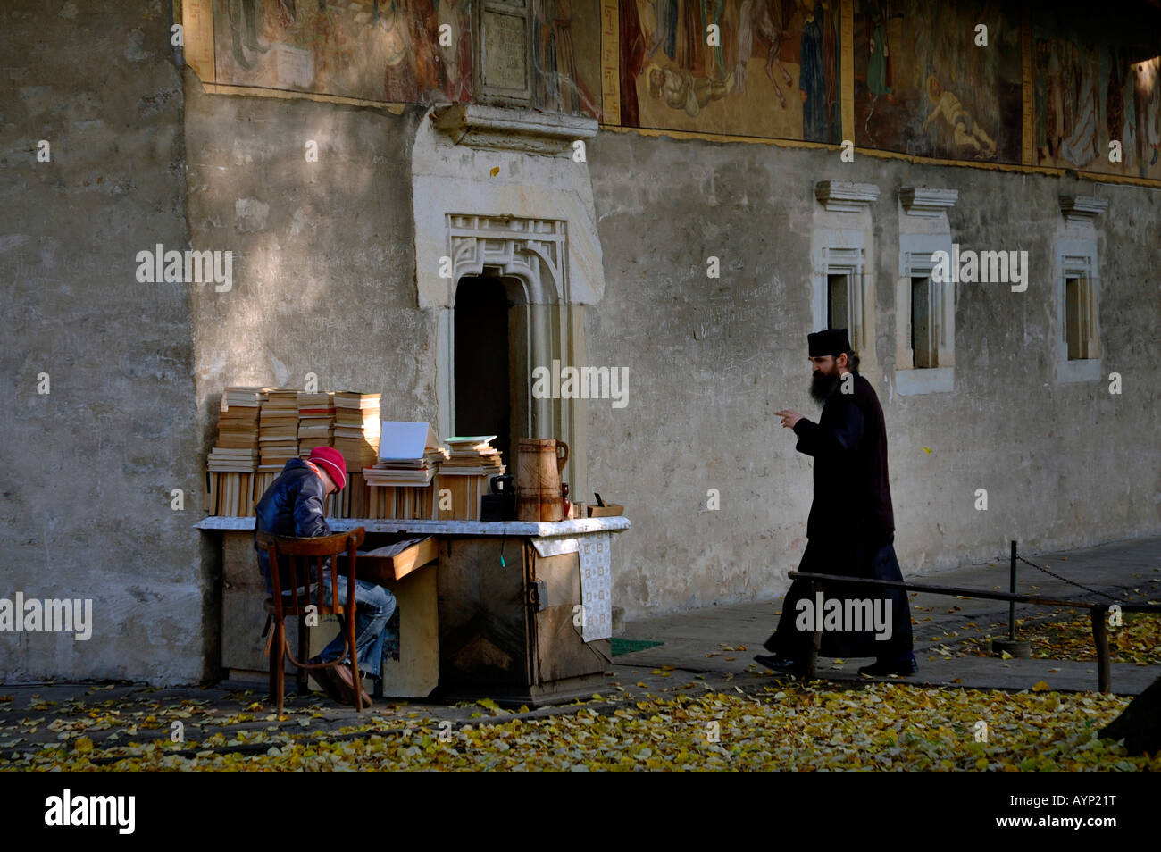 Romanian Orthodox priest walking into a monastery Stock Photo - Alamy
