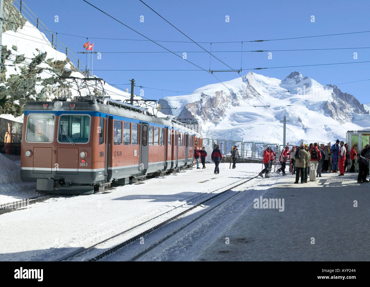 swiss alps with railway and train Stock Photo - Alamy