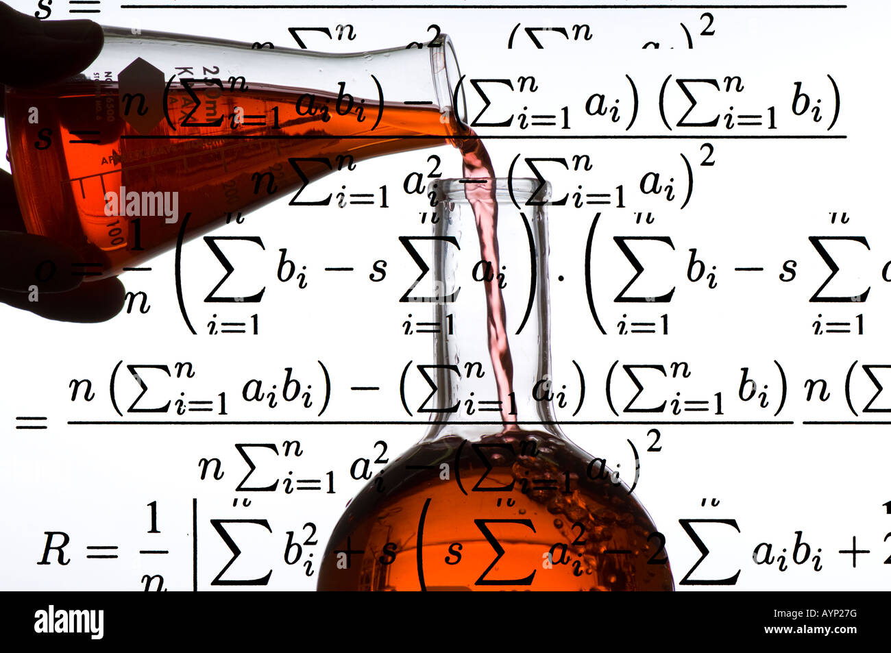 pouring liquid from Erlenmeyer flask into round beaker in lab ...