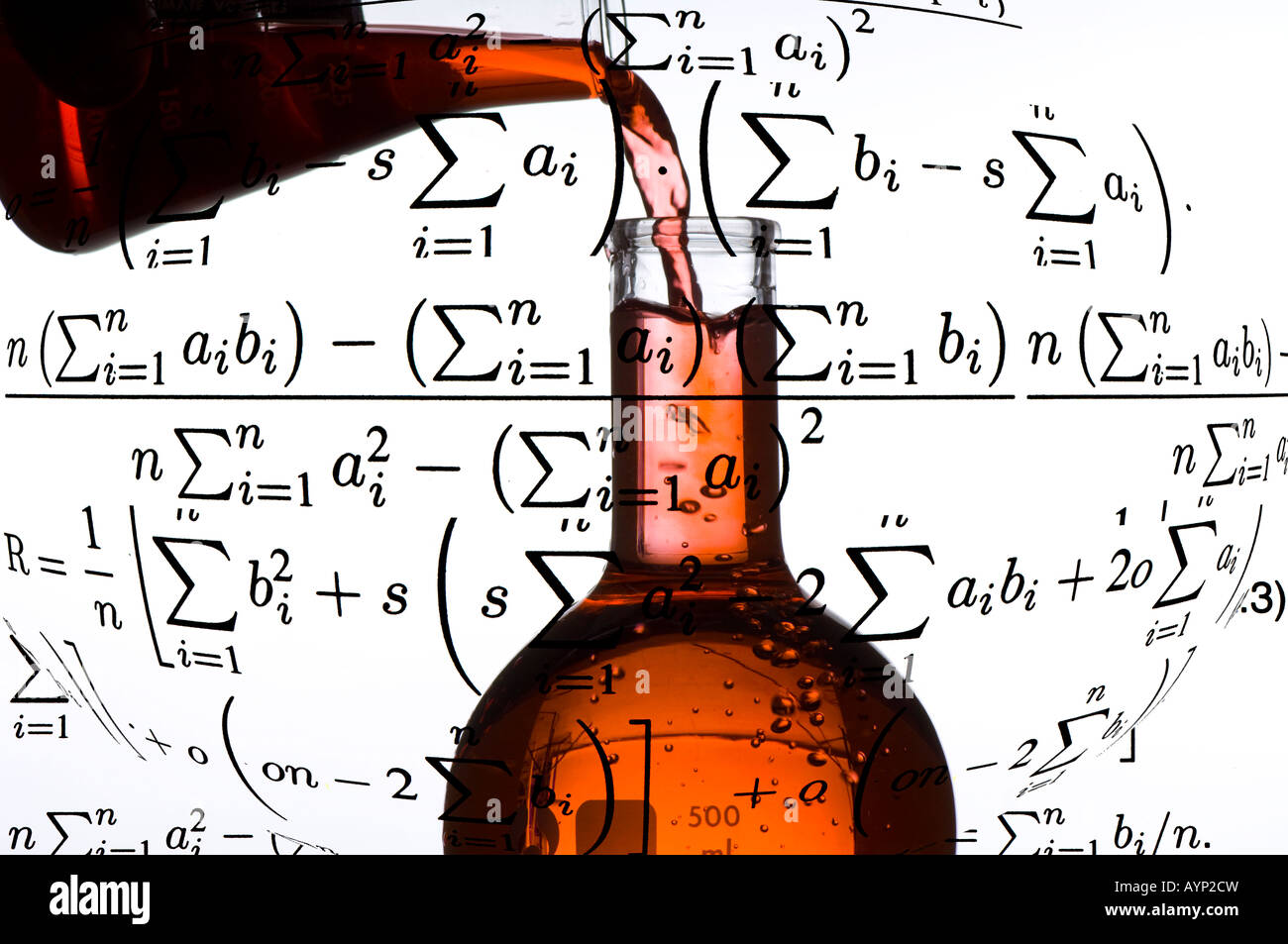 pouring liquid from Erlenmeyer flask into round beaker in lab ...