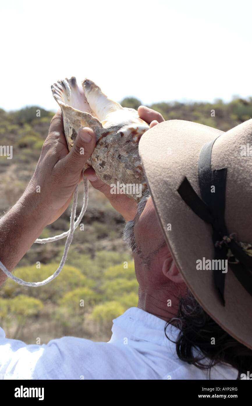 Man Blowing Conch Shell High Resolution Stock Photography and Images ...