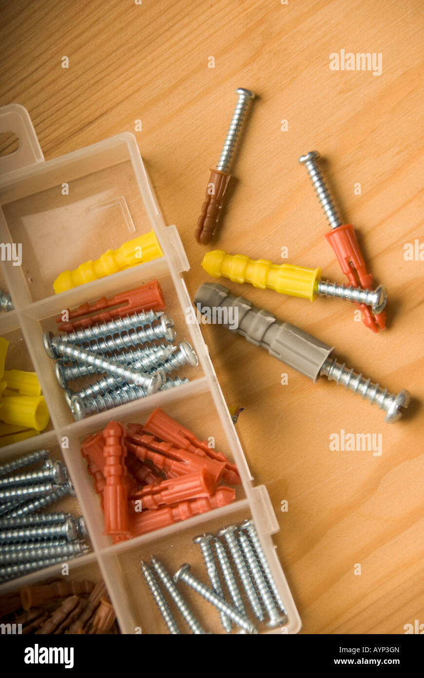 close up of screws and wallplugs in plastic box Stock Photo - Alamy