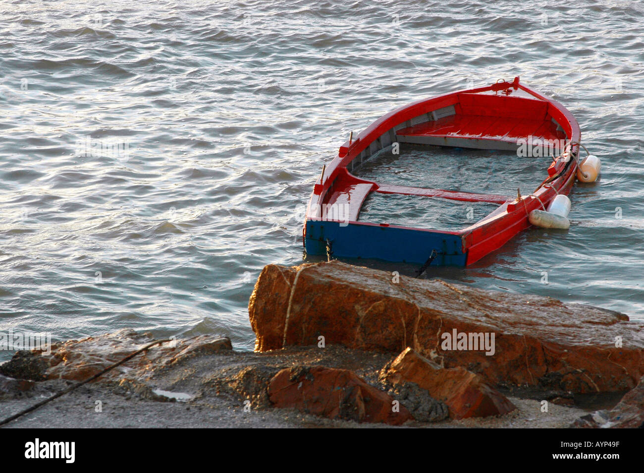 red fisherboat while is sinking Stock Photo - Alamy