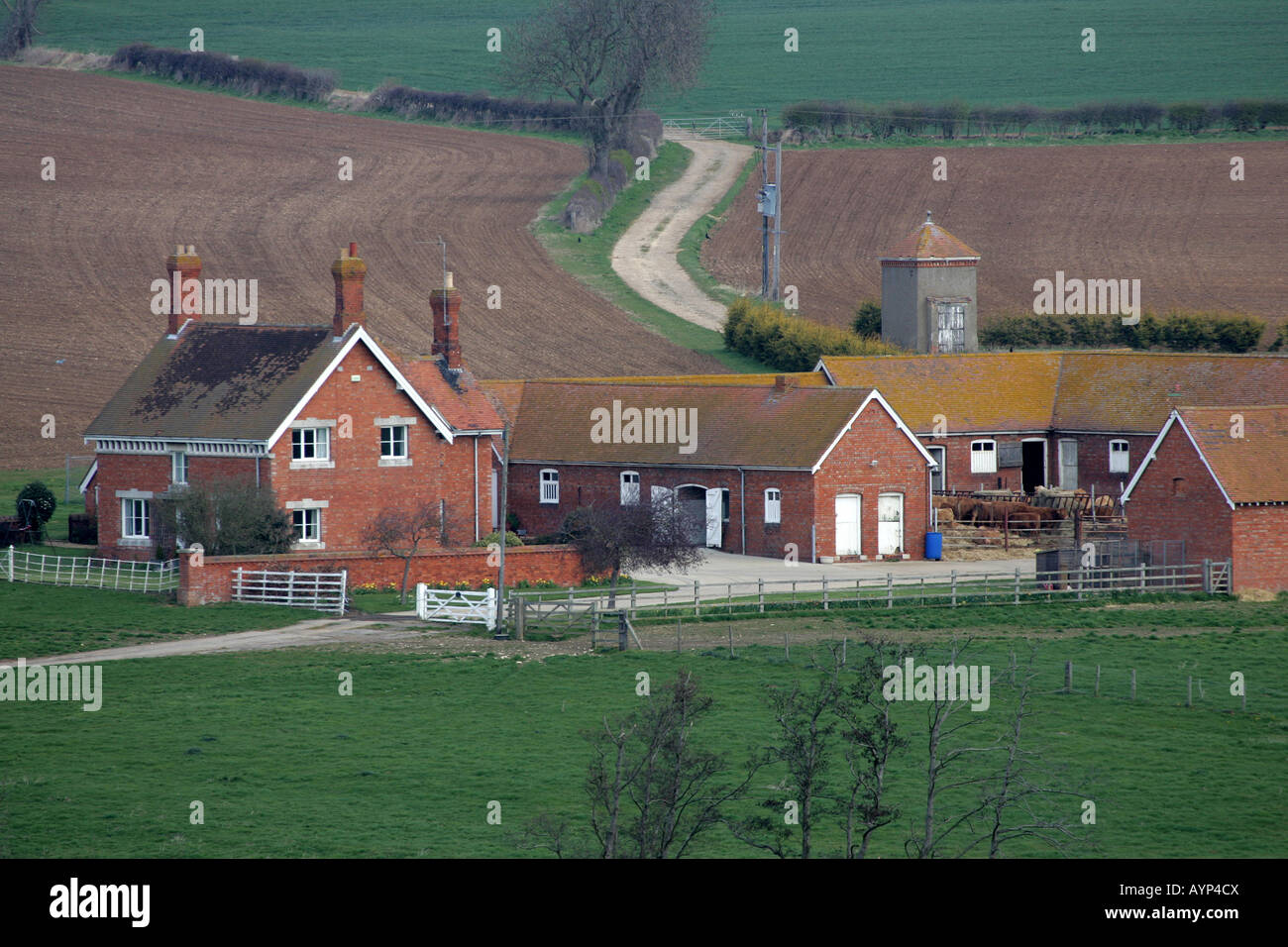 Farmhouse Buildings In Rolling Countryside Stock Photo - Alamy