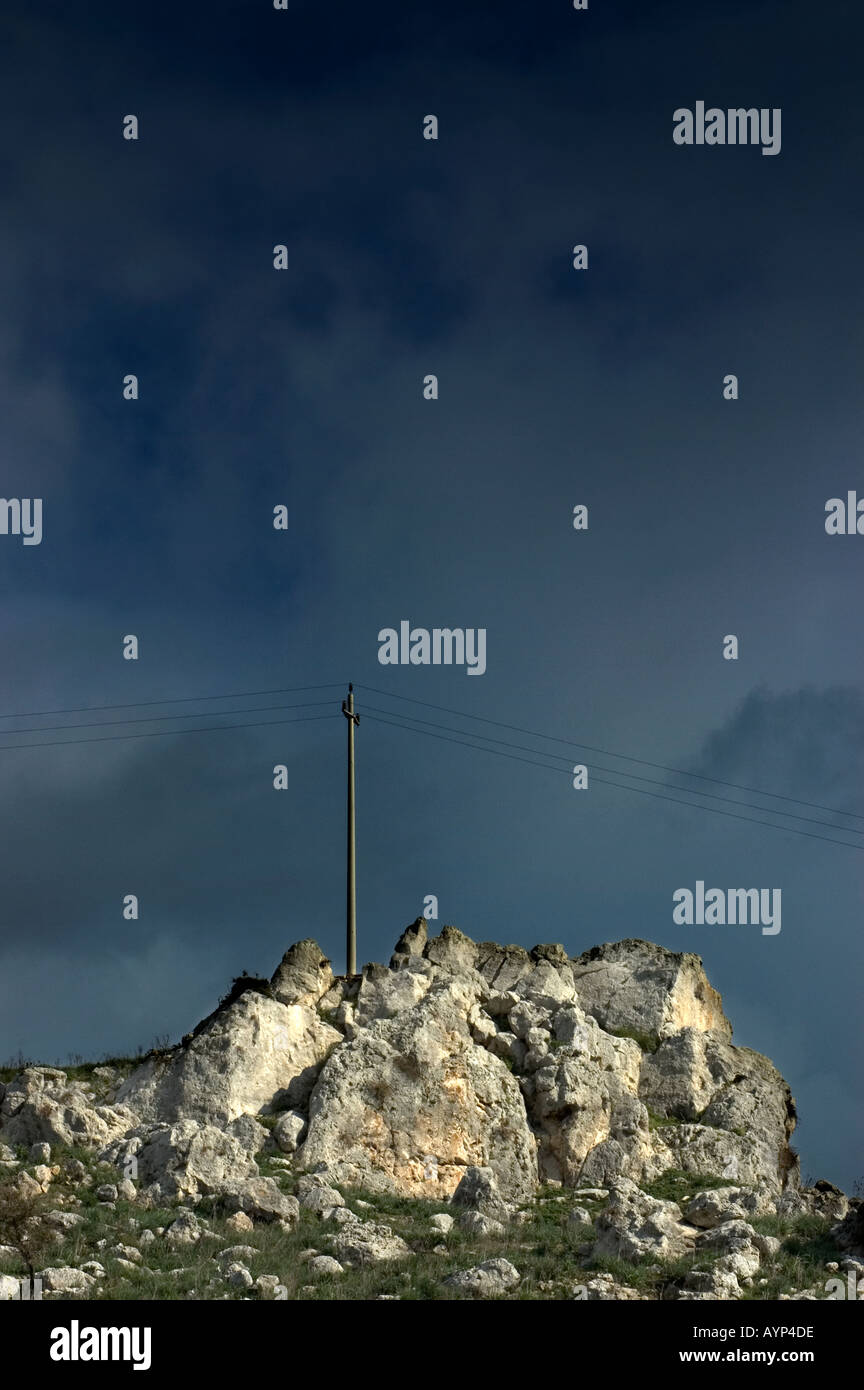 pylon on the rock and stormy sky Stock Photo - Alamy