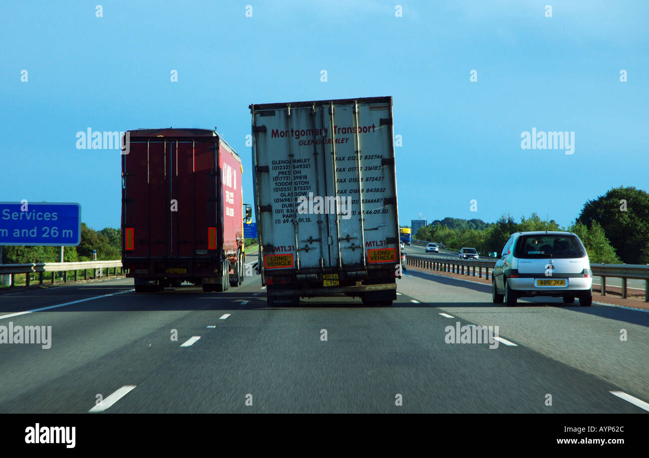 Leaning lorry on motorway due to poor loading or mechanical fault Stock ...