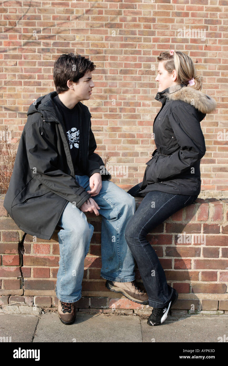 Teenagers facing brick wall hi-res stock photography and images - Alamy
