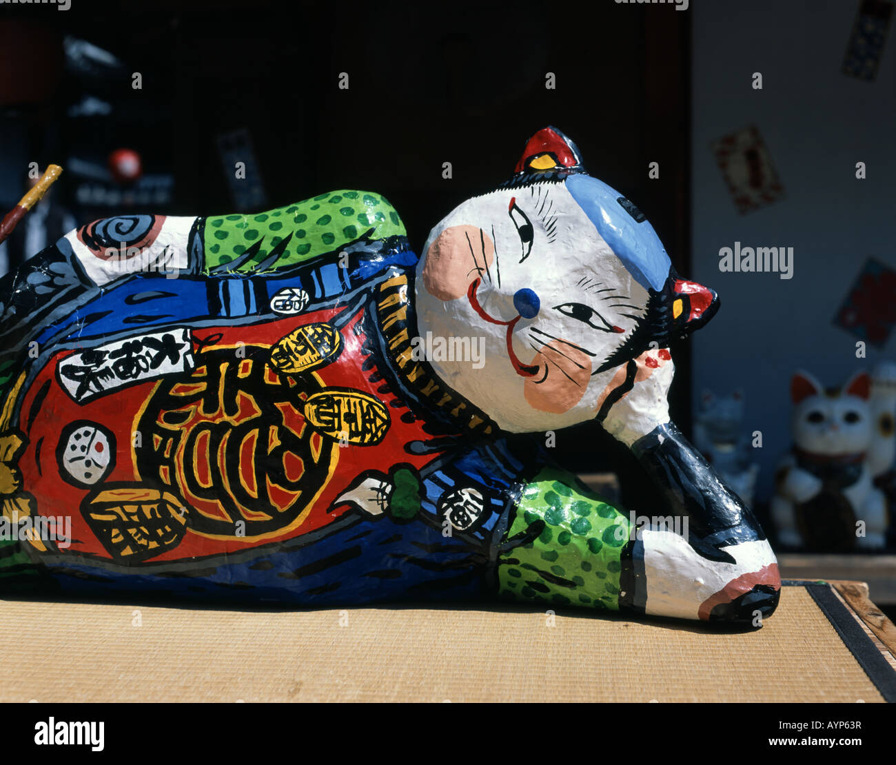 A modern interpretation of a traditional Maneki Neko cat figure ...