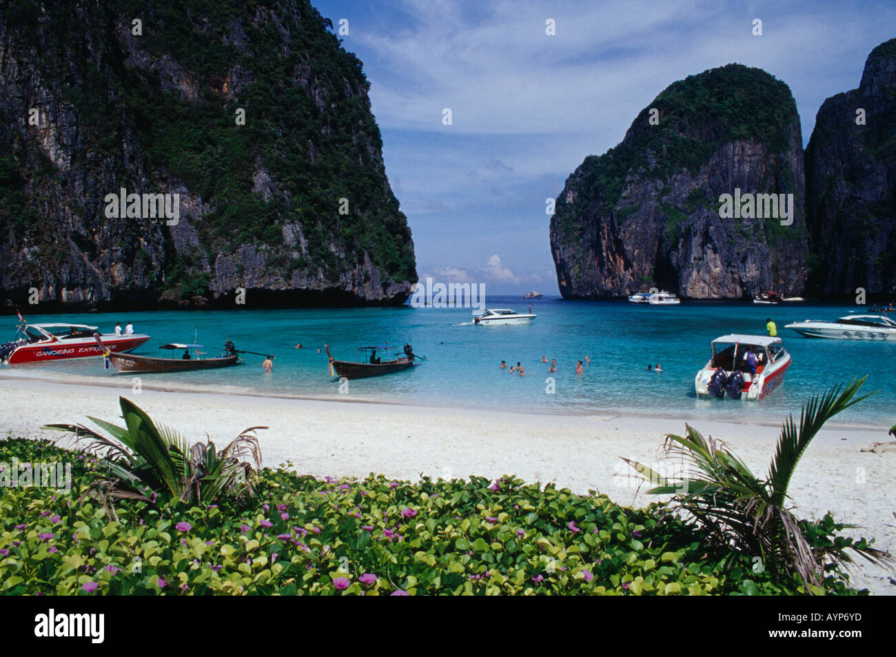 THAILAND Southeast Asia Krabi Province Koh Phi Phi Leh Maya Bay Tourists and boats in water by ...