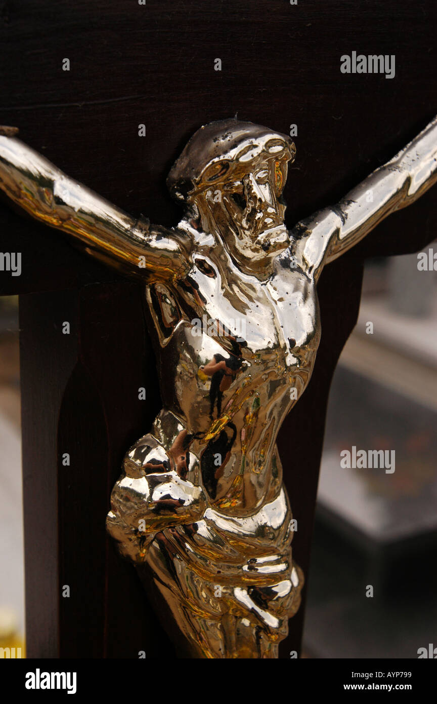 Silver metal statue of Jesus Christ crucified on dark wooden cross Stock Photo - Alamy