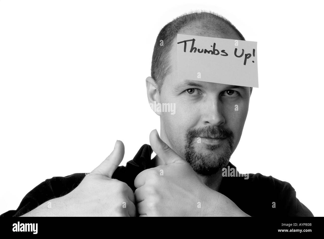 man with a post it note on his head representing that every thing is ok ...