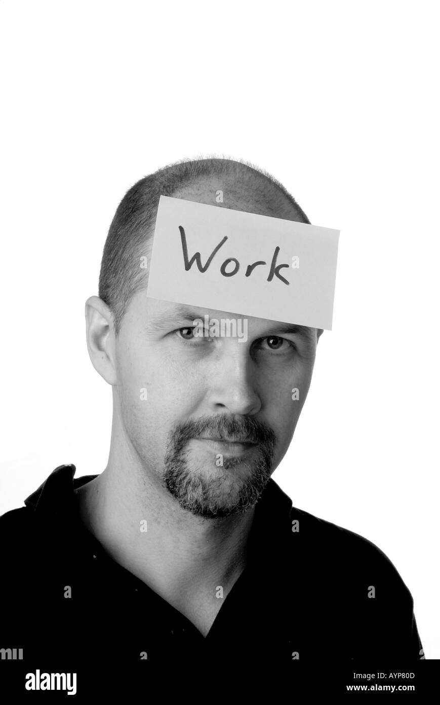 man with post it note on his to illustrate that he is thinking about ...