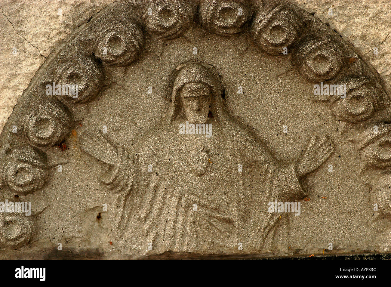 Stone bas-relief of Jesus Chris showing his both hands in an open ...