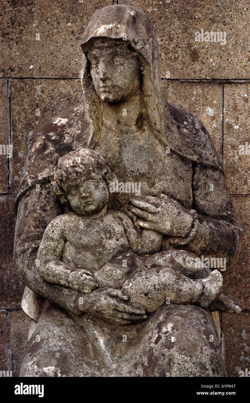 Stone statue of Virgin Mary with child cherub angel Stock Photo - Alamy