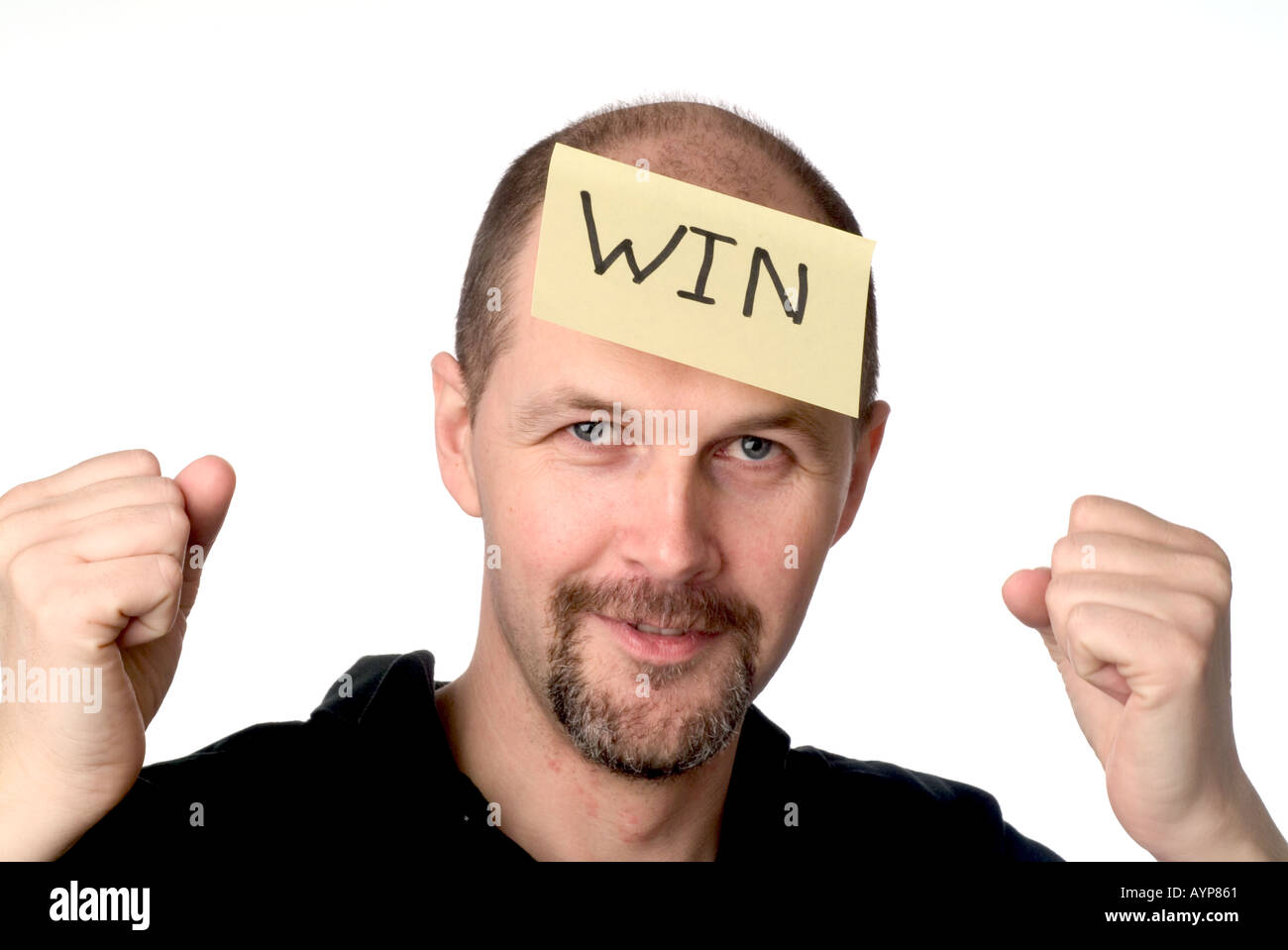 man with a post it note on his head representing that he is a winner ...