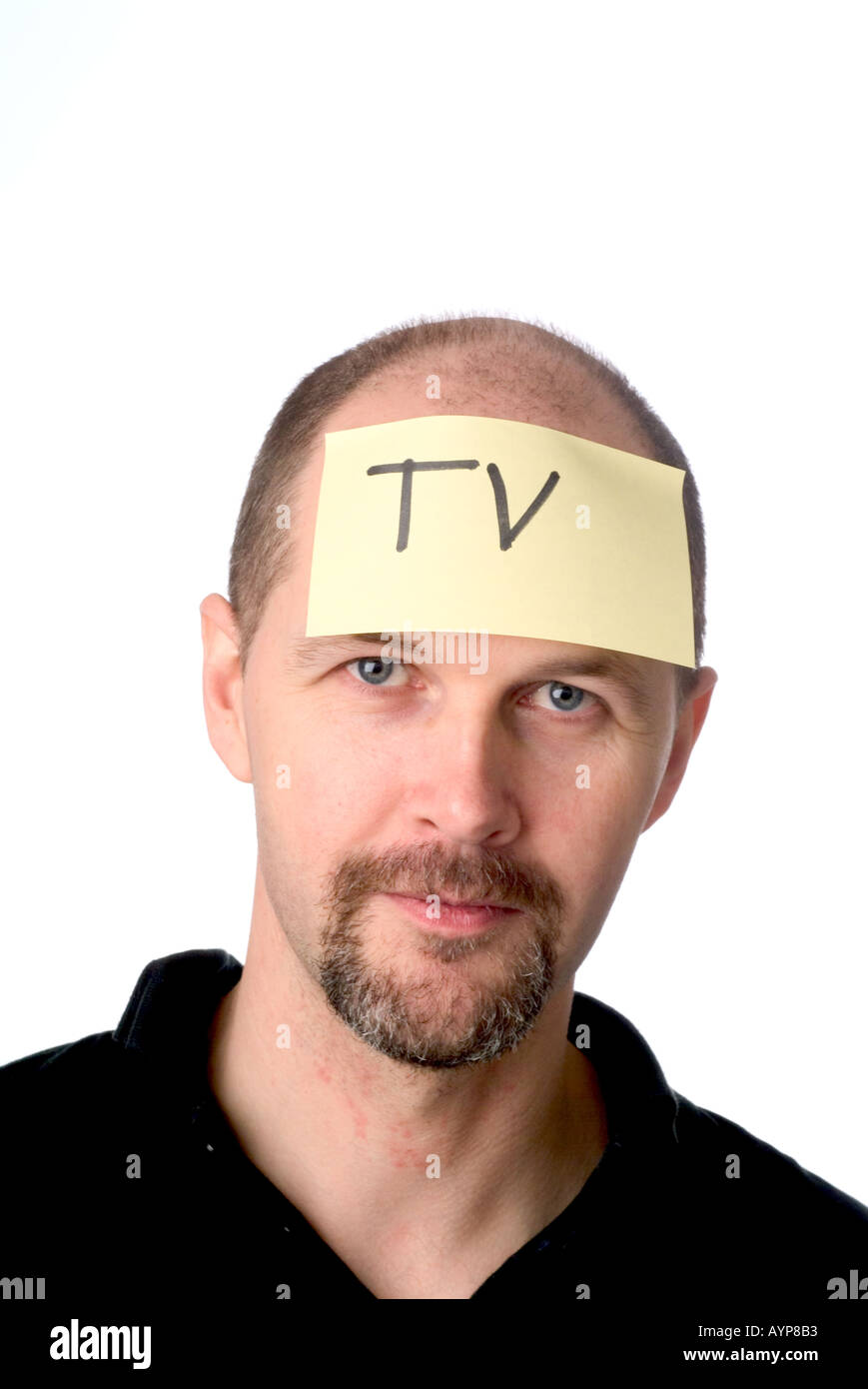 man with post it note on head depicting man thinking about what is tv ...
