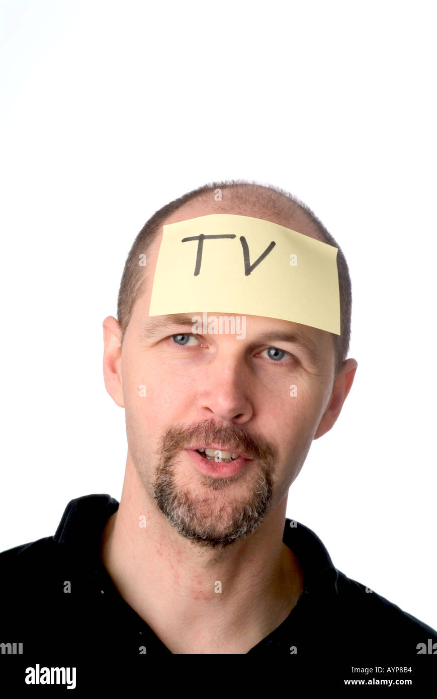 man with post it note on head depicting man thinking about what is tv ...