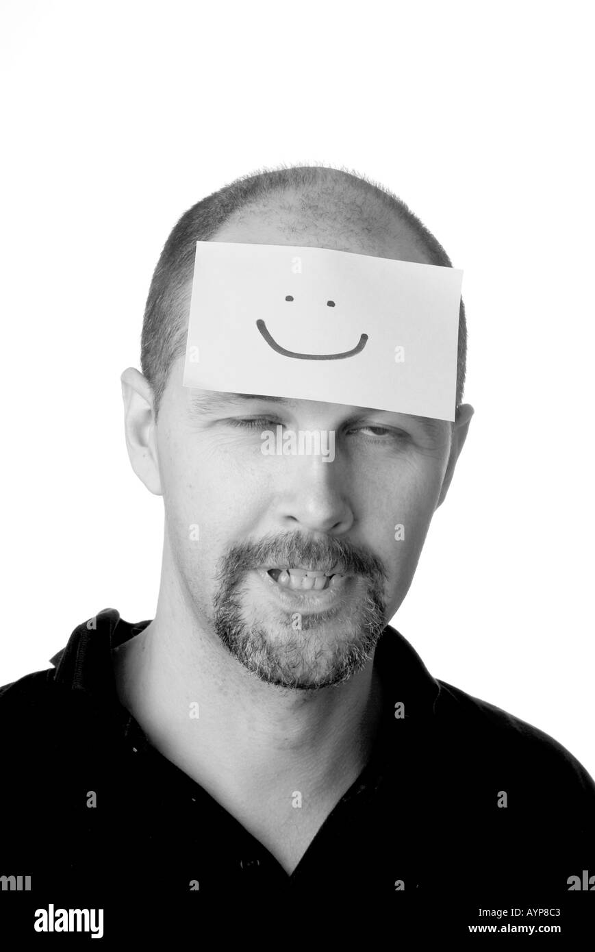 man with post it note on head looking sad happy mood thought idea ...