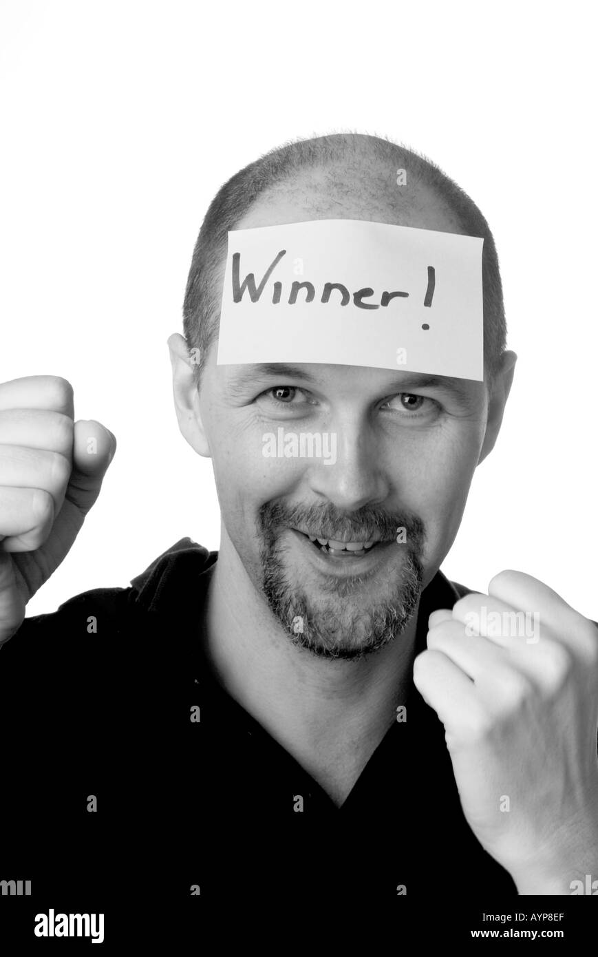 man with post it note on head depicting the feeling of winning win ...