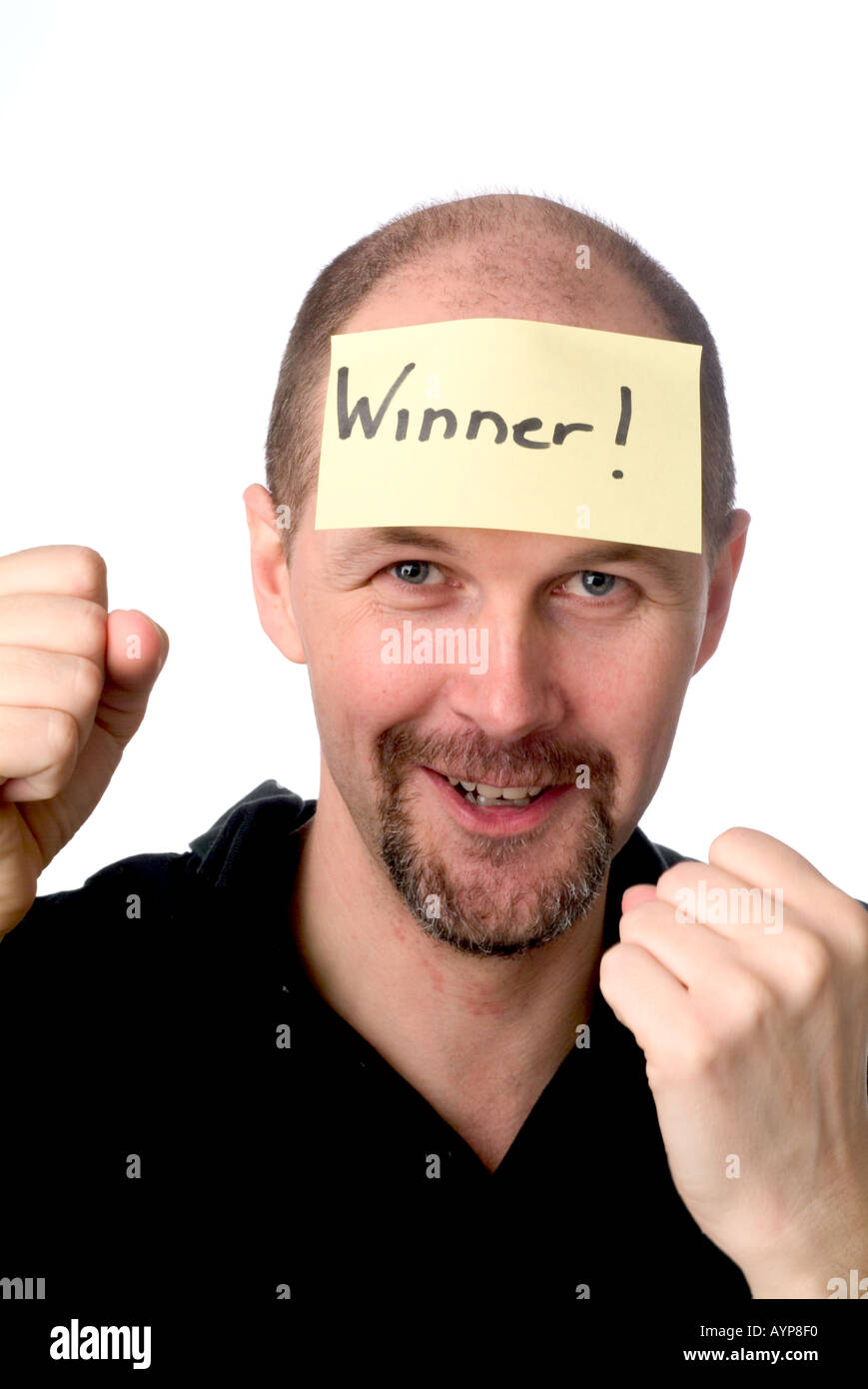 man with post it note on head depicting the feeling of winning win ...