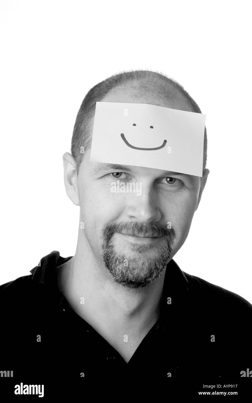 man with post it note on head depicting happy pleased smile glad enjoy ...