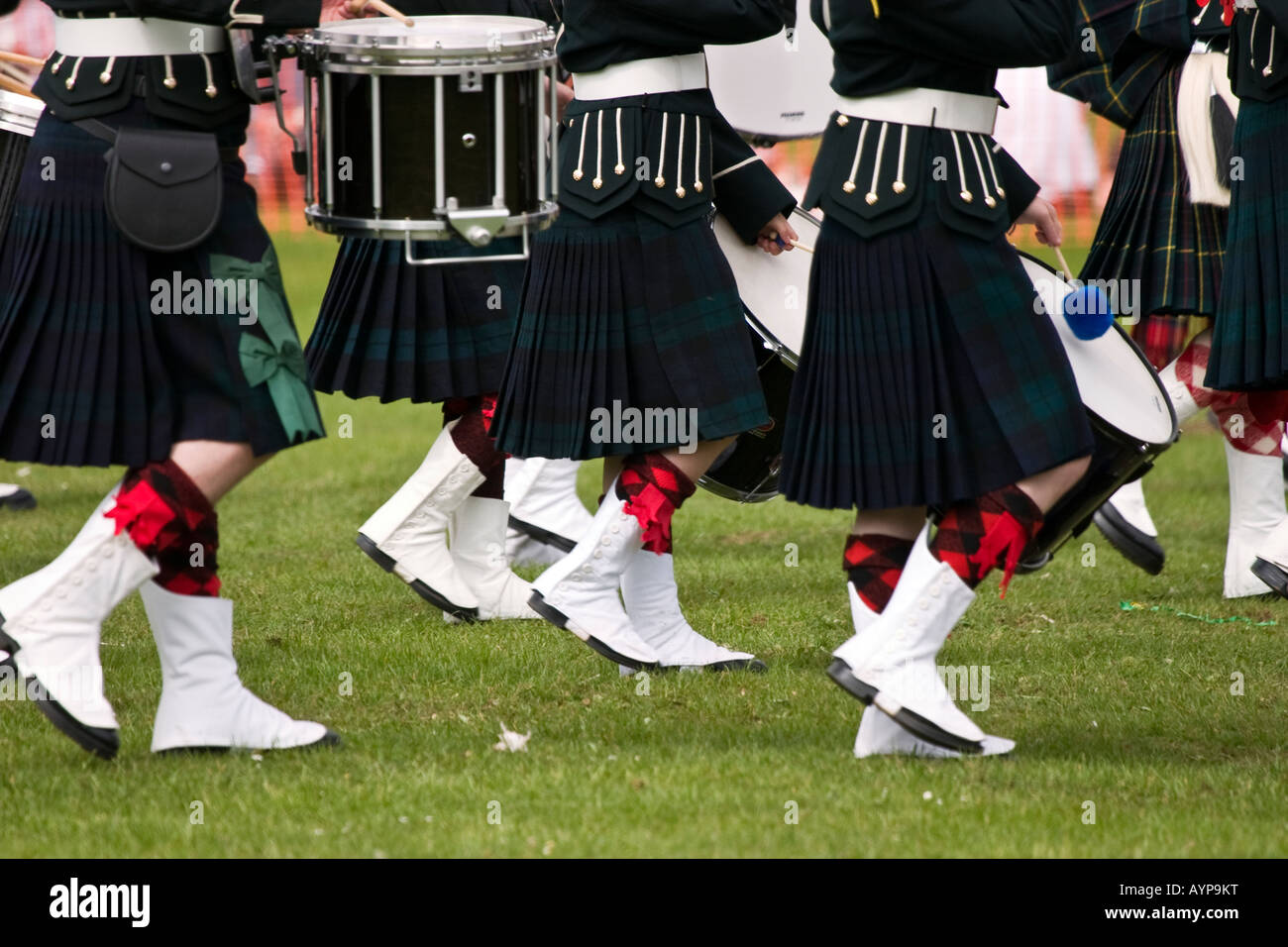 White boots Scottish marching band in kilts with drums Stock Photo - Alamy