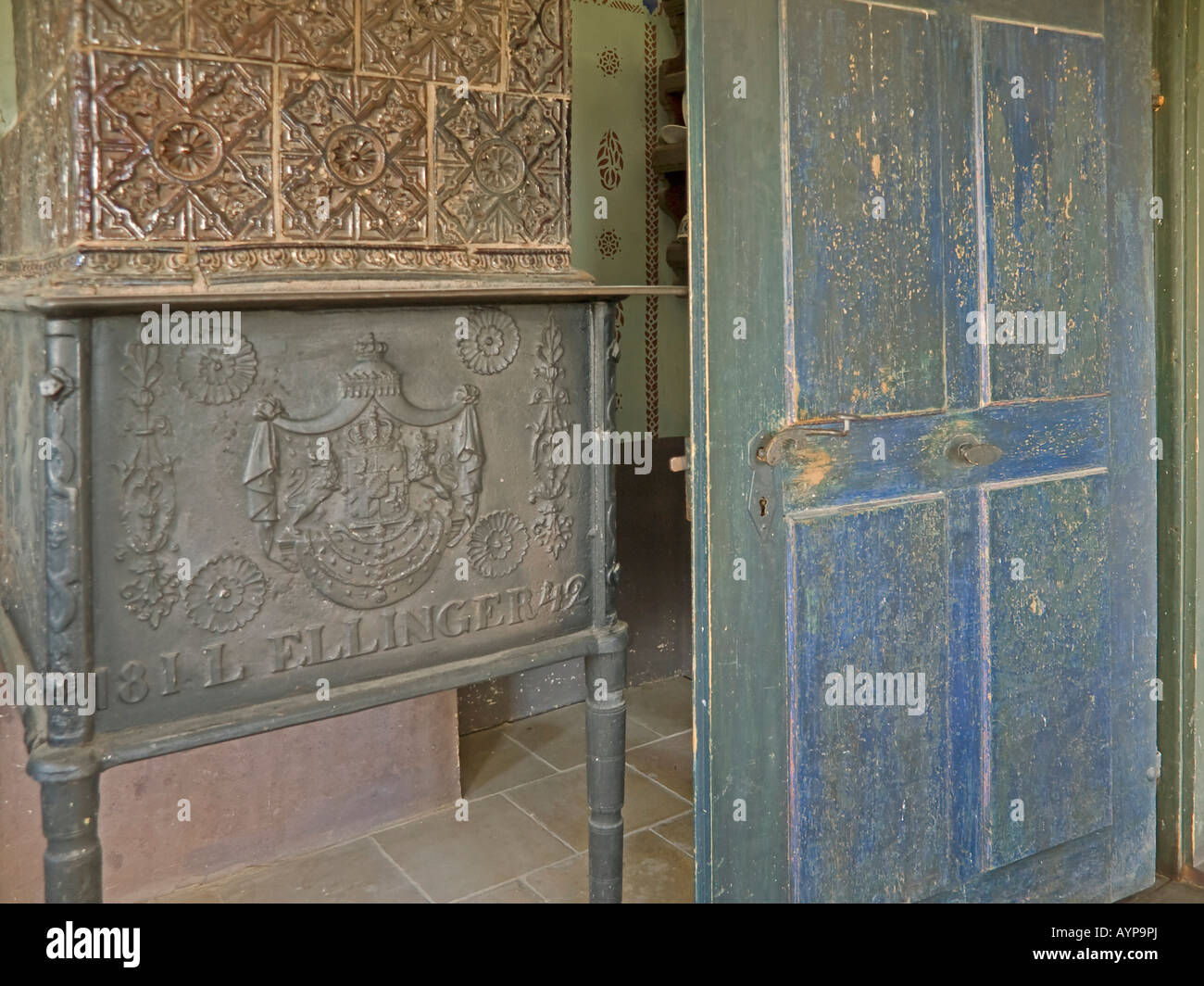 tiled stove interior view in an old house with original historic ...