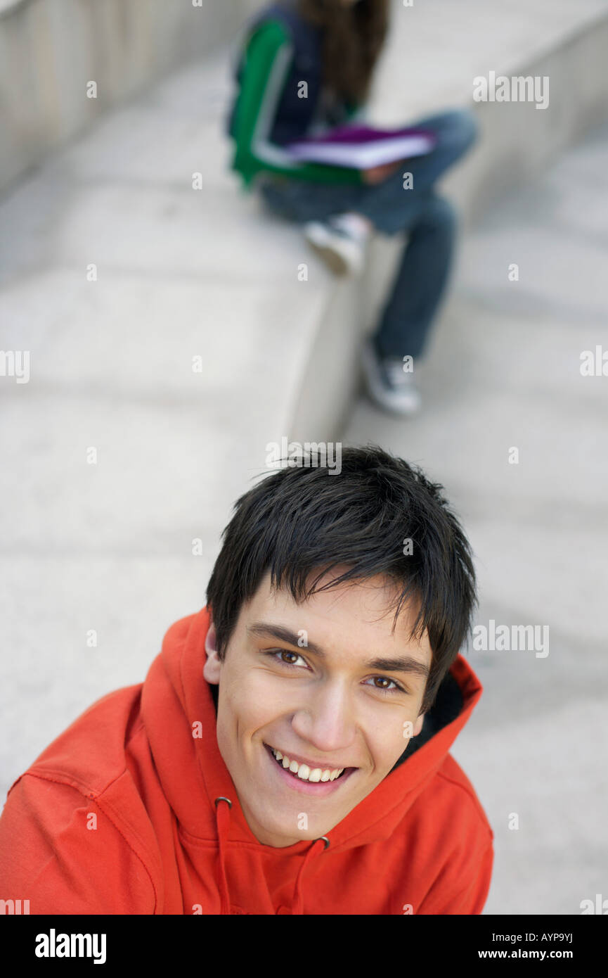 Young man smiling at camera Stock Photo - Alamy