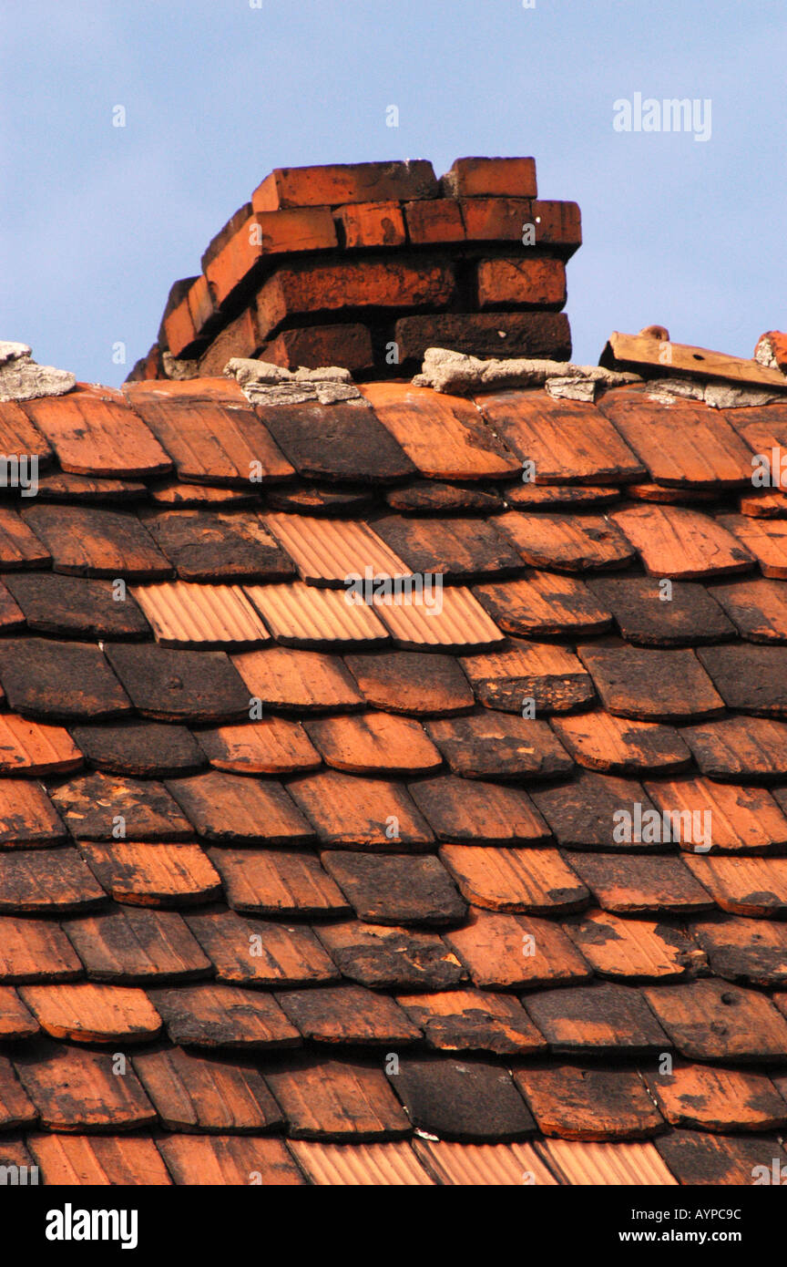 Red Old tiles with chimney Stock Photo - Alamy