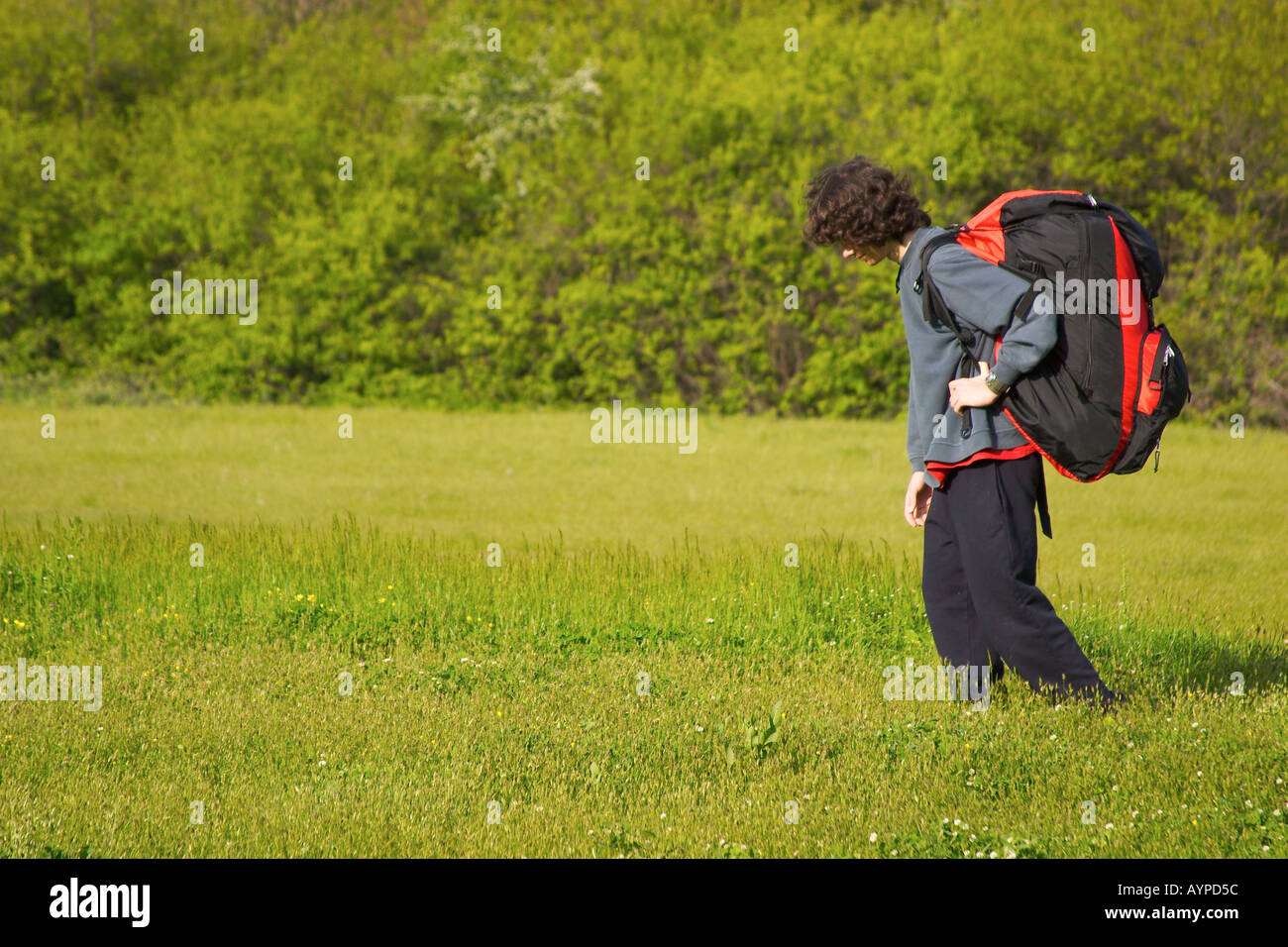 Teenager boy carrying glider in a backpack Stock Photo - Alamy