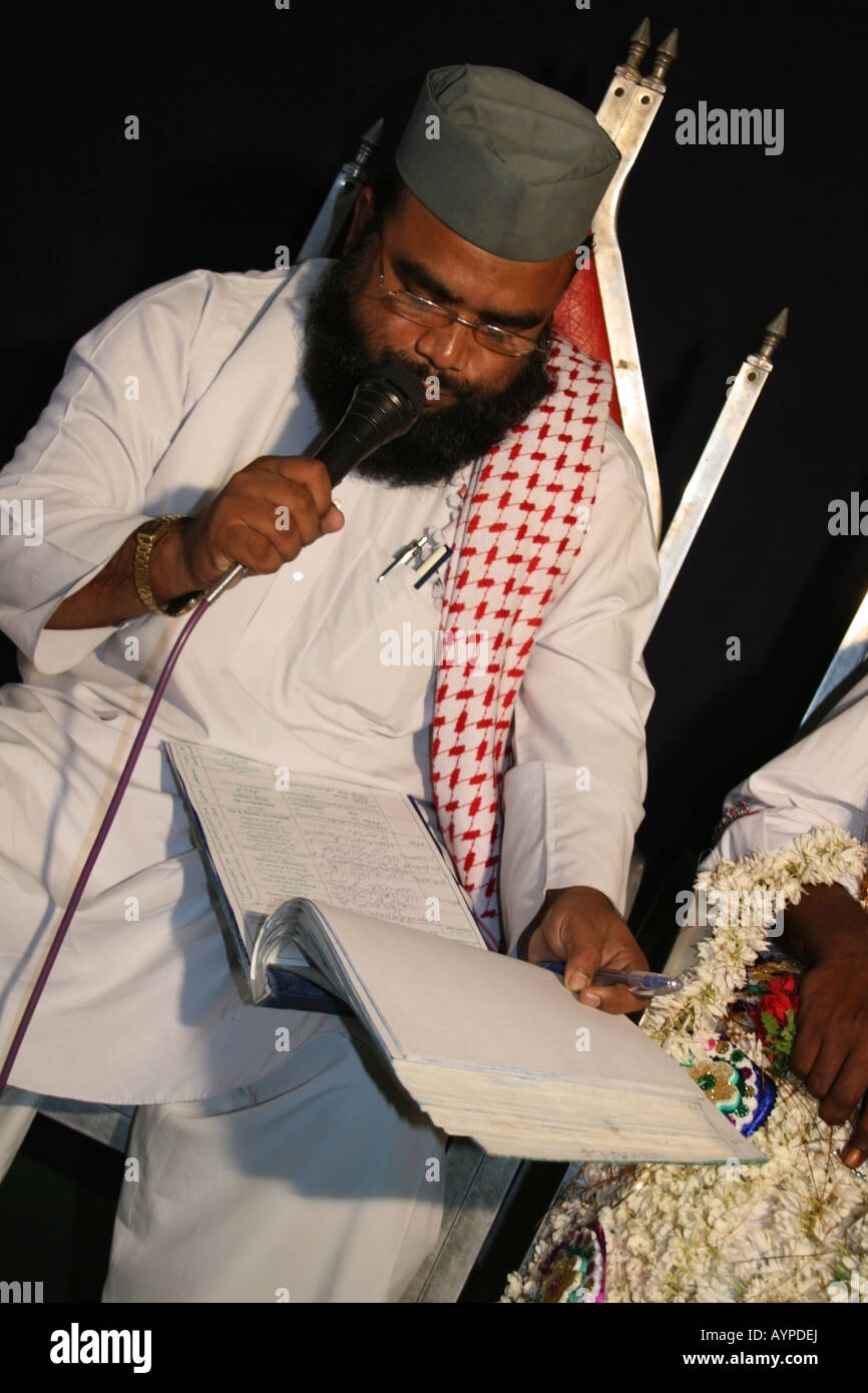 Maulvi or Imam conducts Islamic wedding ceremony or Nikkah reading the ...