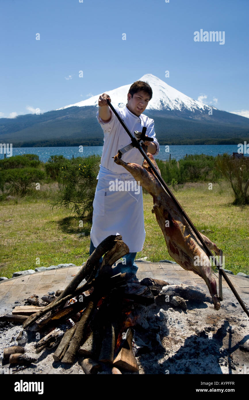 Chef roasting lamb Lake Llanquihue and Osorno Volcano Chile Stock Photo ...
