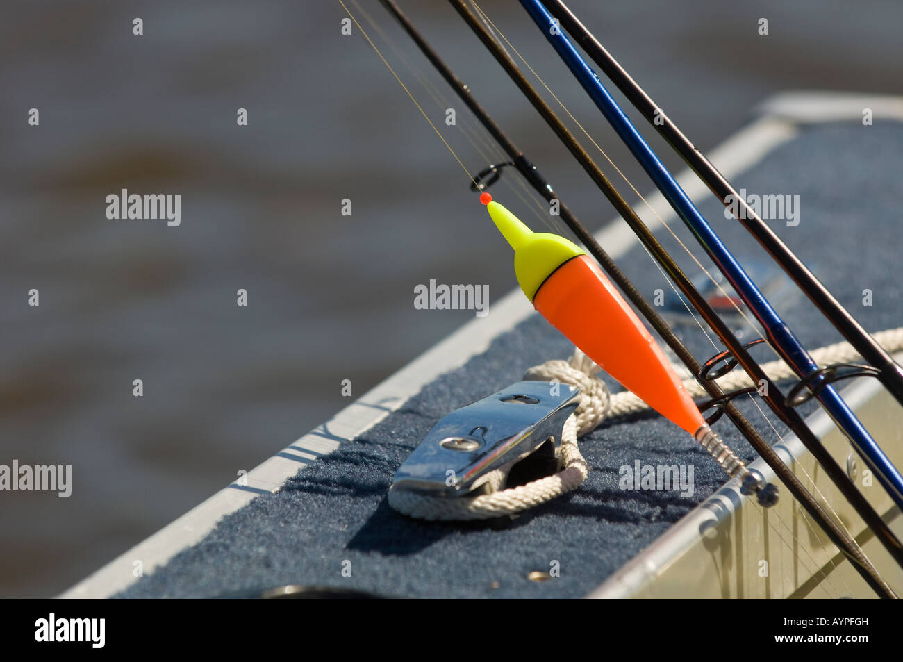 FISHING POLES AND BOBBER ON BOAT Stock Photo - Alamy