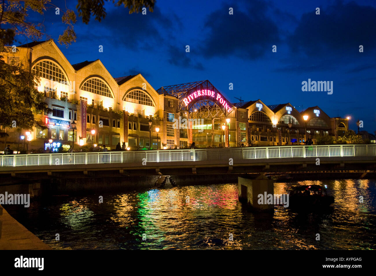 Shopping mall stores and restaurants on waterfront at Clarke Quay ...