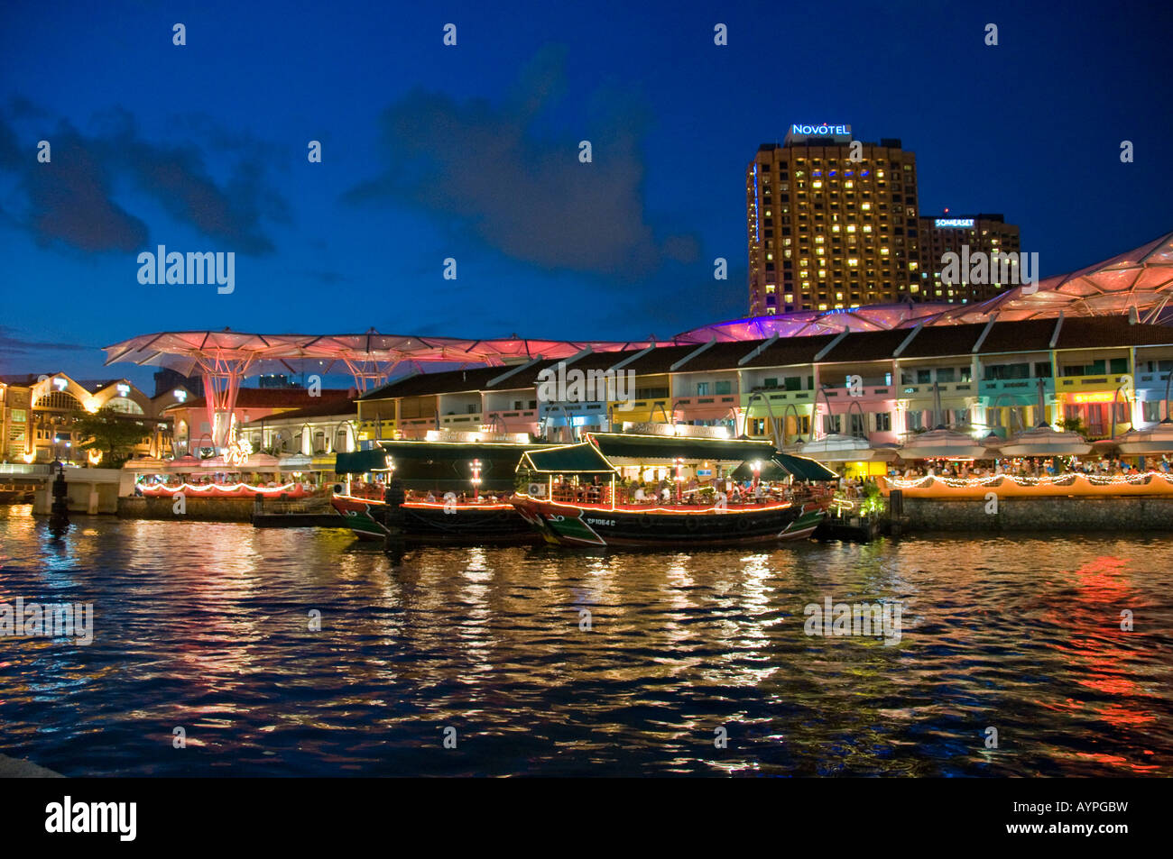 Shopping mall stores and restaurants on waterfront at Clarke Quay ...
