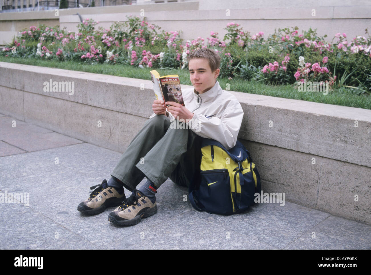 High school student reading book on plaza hi-res stock photography and ...