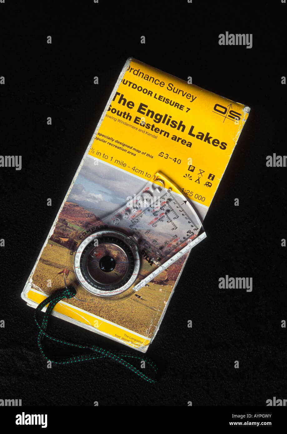 Compass sat on top of an old Ordnance Survey map of the English Lakes ...