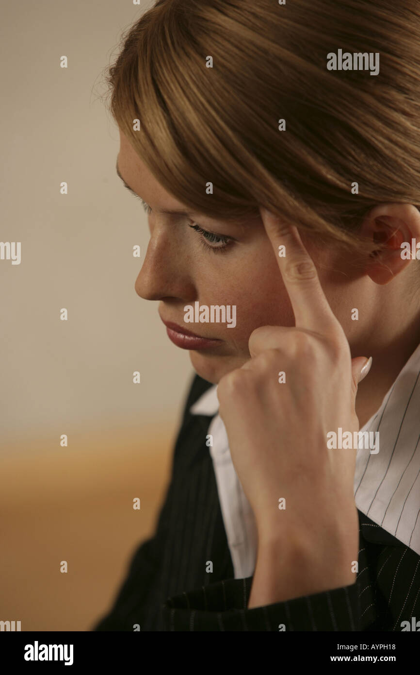 A side view of a blonde businesswoman looking over her laptop Stock ...