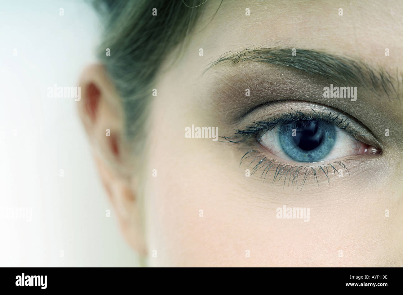 Close up of a blue eyed woman as one eye is focused Stock Photo - Alamy