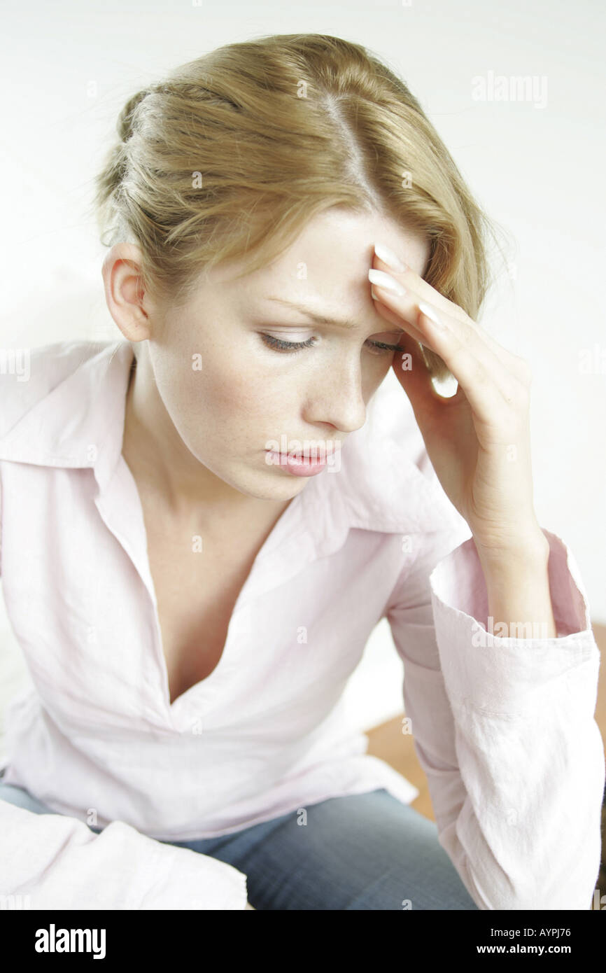 A side view of a depressed young woman Stock Photo - Alamy
