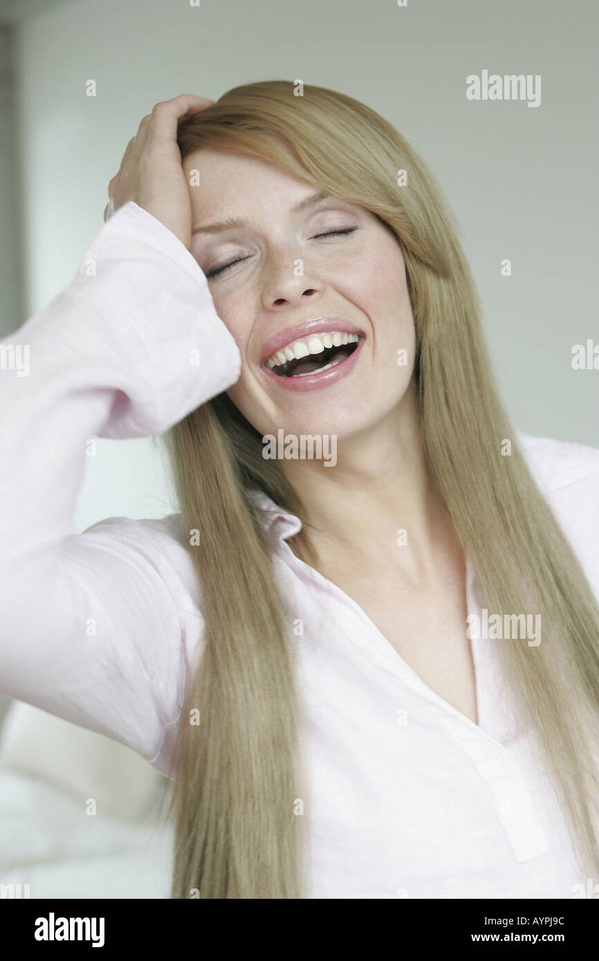 An ecstatic blonde woman Stock Photo - Alamy